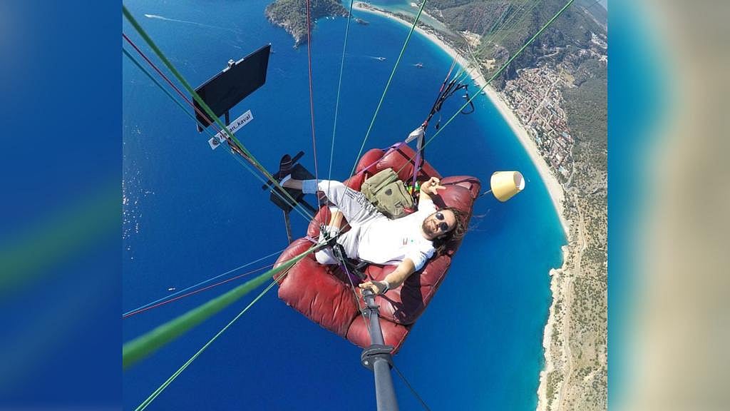 Old video of man paragliding on couch, watching tv, goes viral; WATCH
