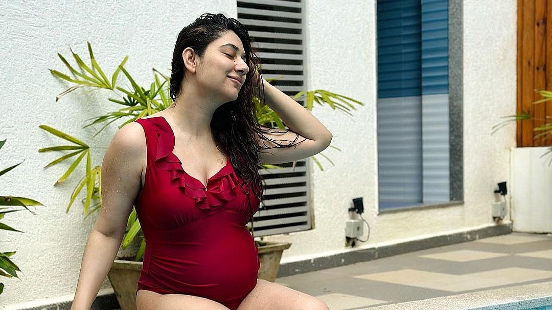 Pregnant Disha Parmar Enjoys Pool Day In Red Monokini, Flaunts Baby Bump In New Photo