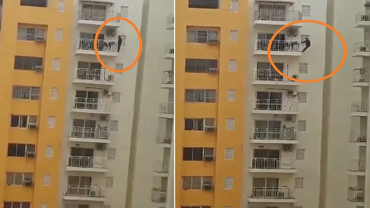 Daredevil workout Video of a man exercising hanging from the balcony of ...